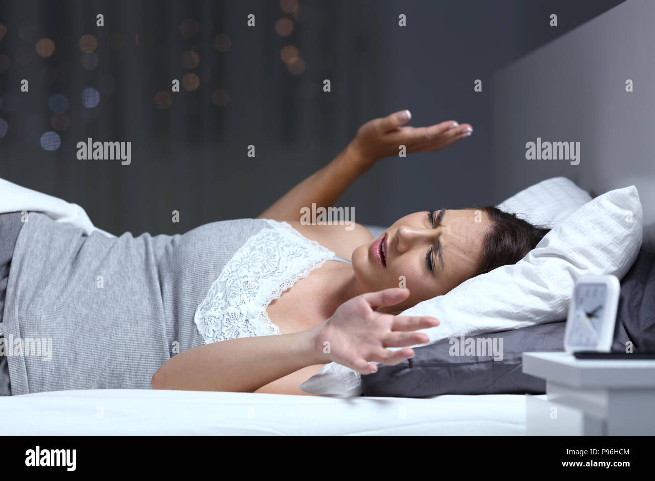 Scared woman alone dark room hi-res stock photography and images - Alamy