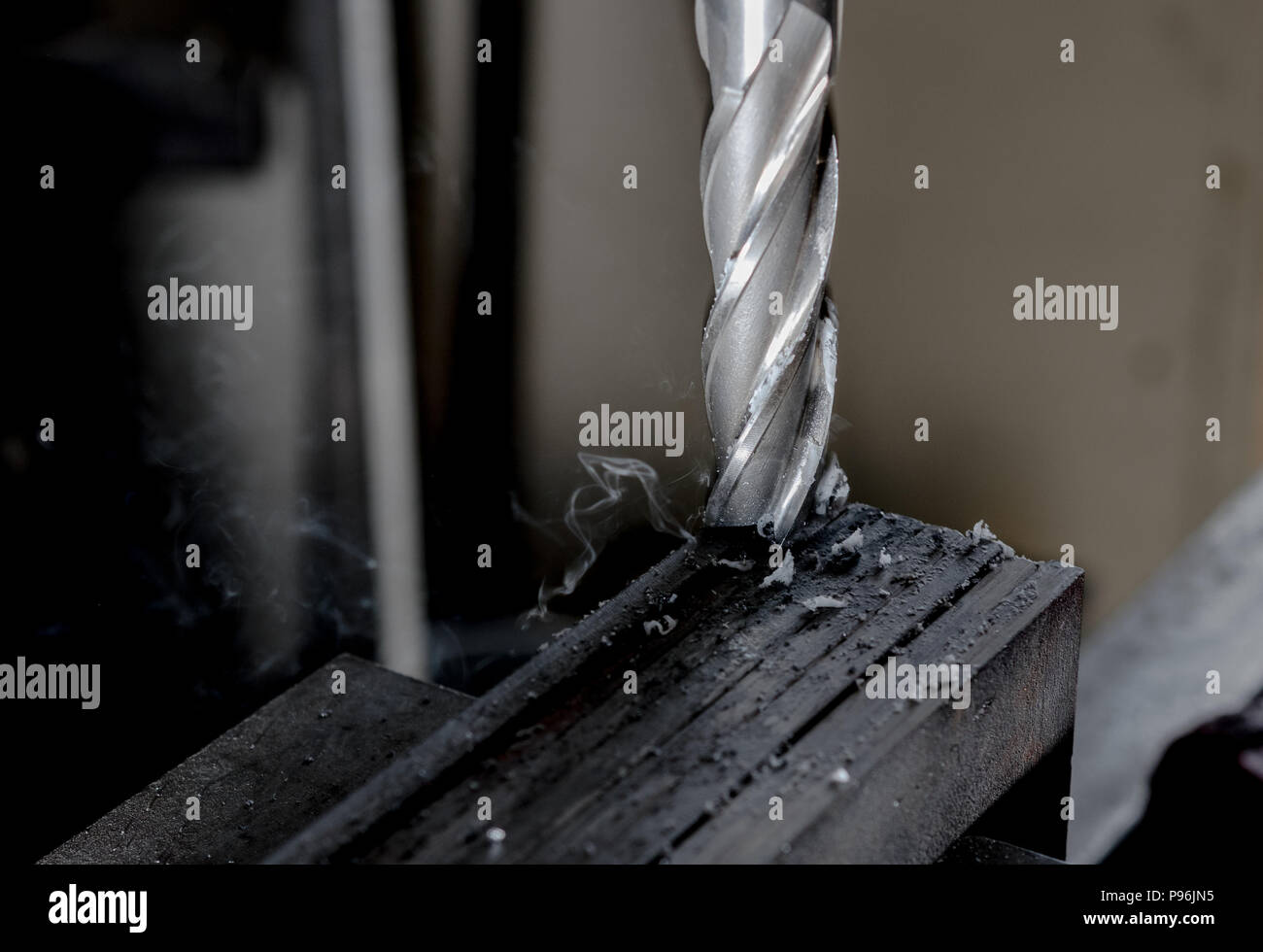 Bridgeport CNC end mill finishing a stack of steel plate with metal ...