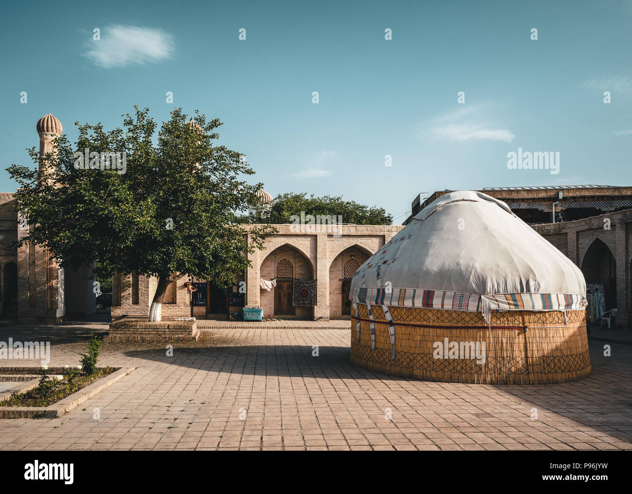 Inside a mosque with traditional yurt sky and tree in Samarkand ...