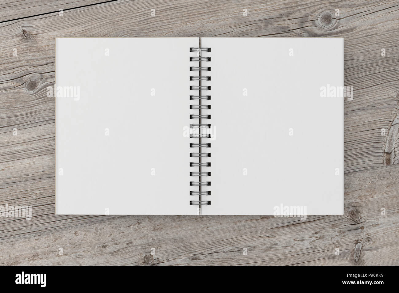 White spiral notepad isolated on wooden background. Include clipping ...