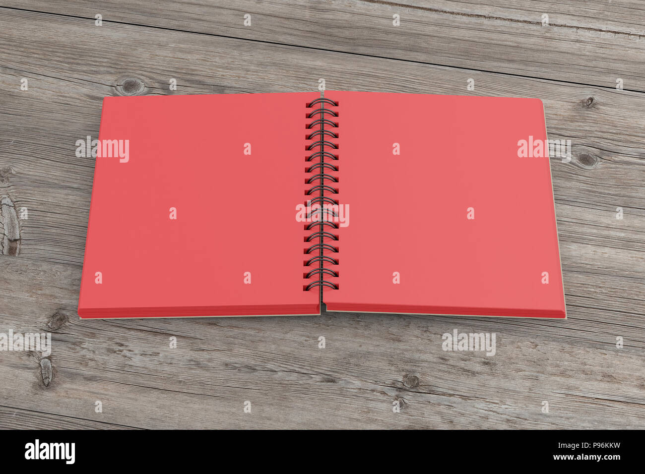 Red spiral notepad isolated on wooden background. Include clipping path ...