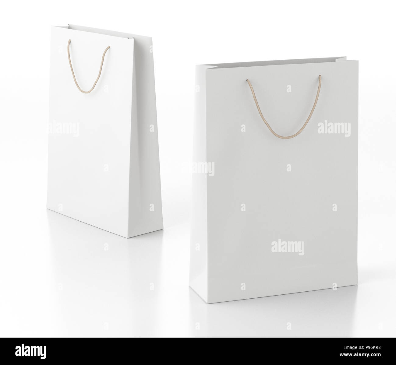 Two white blank paper shopping bags on white background. Isolated ...