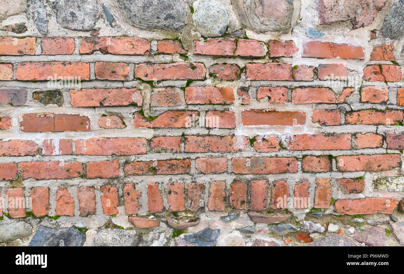 texture of a wall lined with bricks through a cement slurry Stock Photo ...