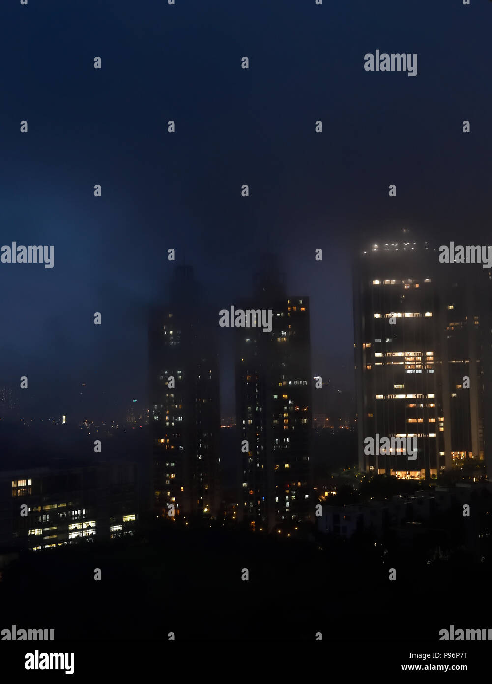 Dramatic City skyline with clouds at dusk Stock Photo - Alamy
