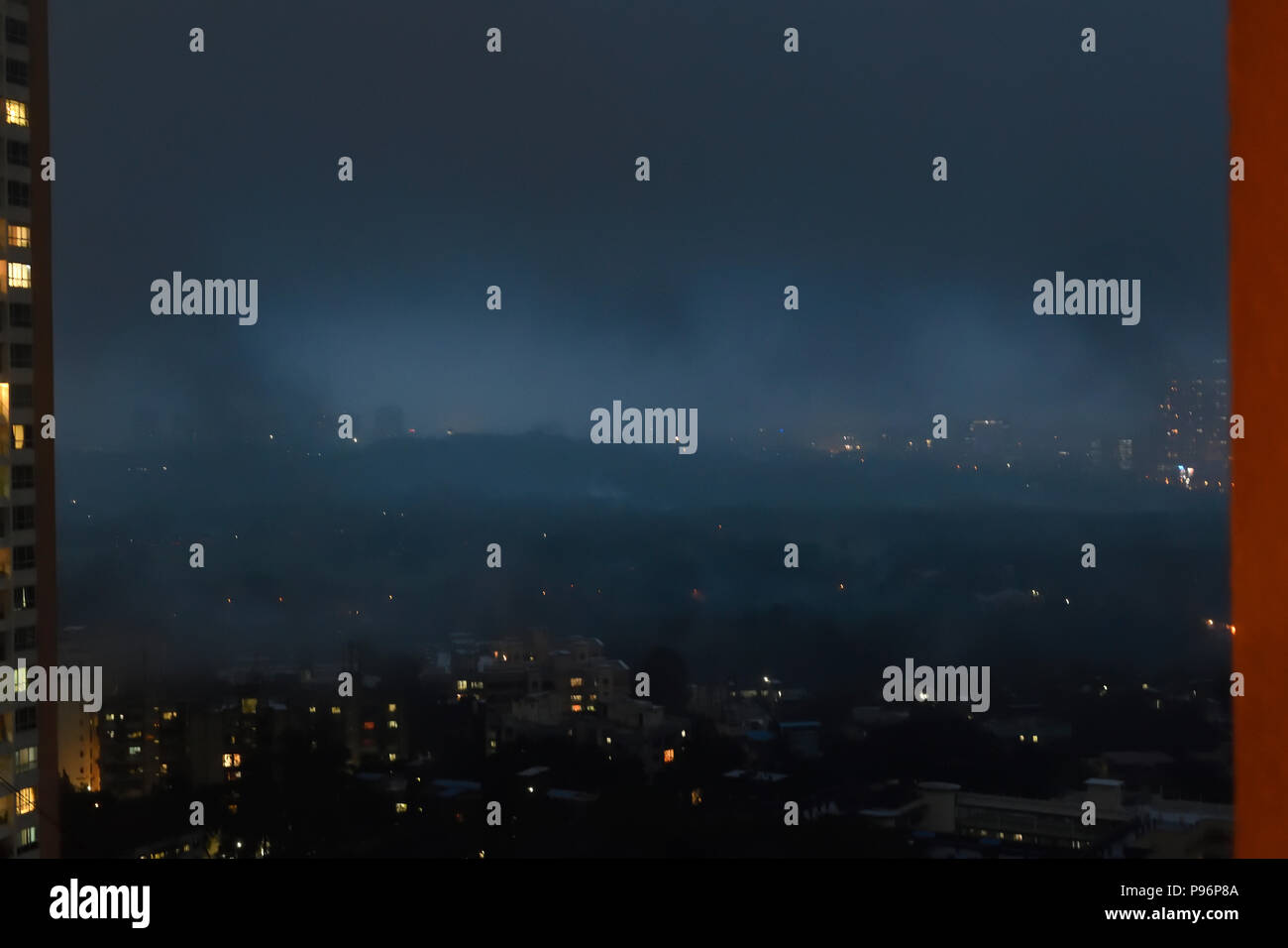 Dramatic City skyline with clouds at dusk Stock Photo - Alamy