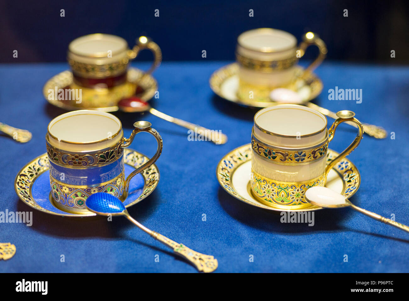 Porcelain saucers and a Cup of tea on a blue background. Faberge Museum ...