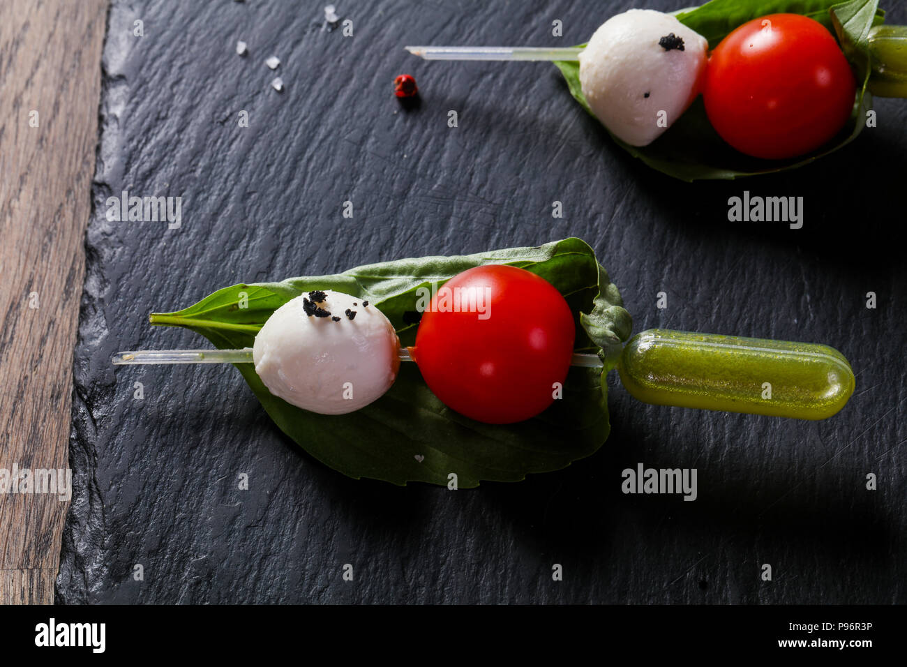 Canape caprese with olive oil Stock Photo - Alamy