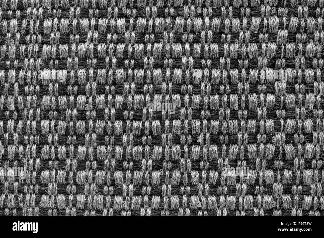 Black hand weaving matting tweed fabric texture. Closeup horizontal ...