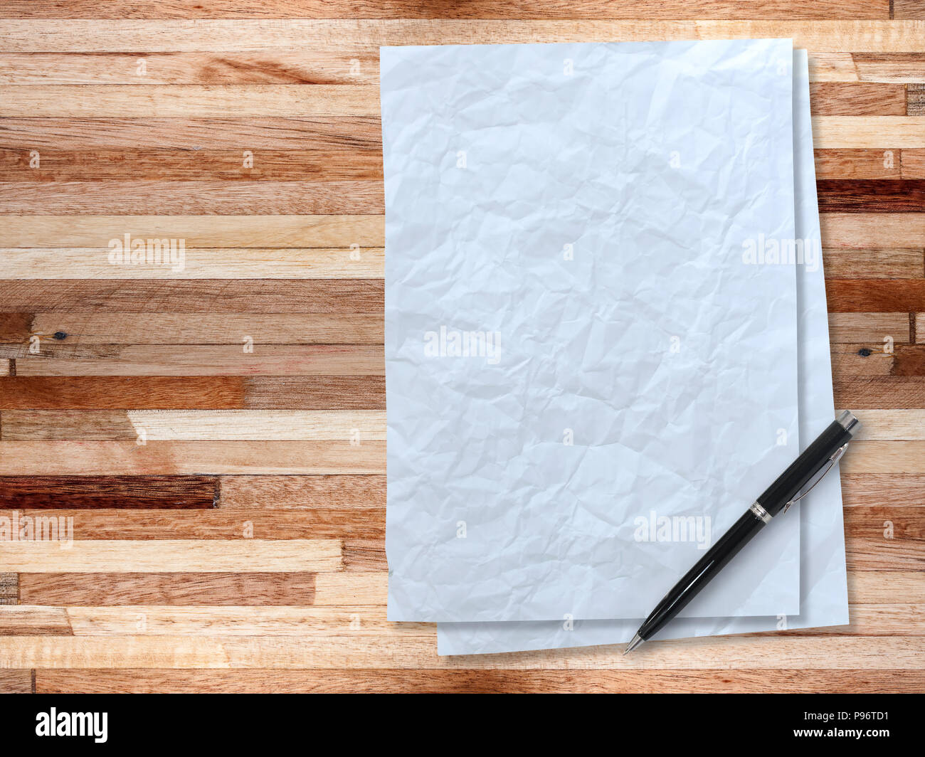 Old white paper sheet on wooden table Stock Photo - Alamy