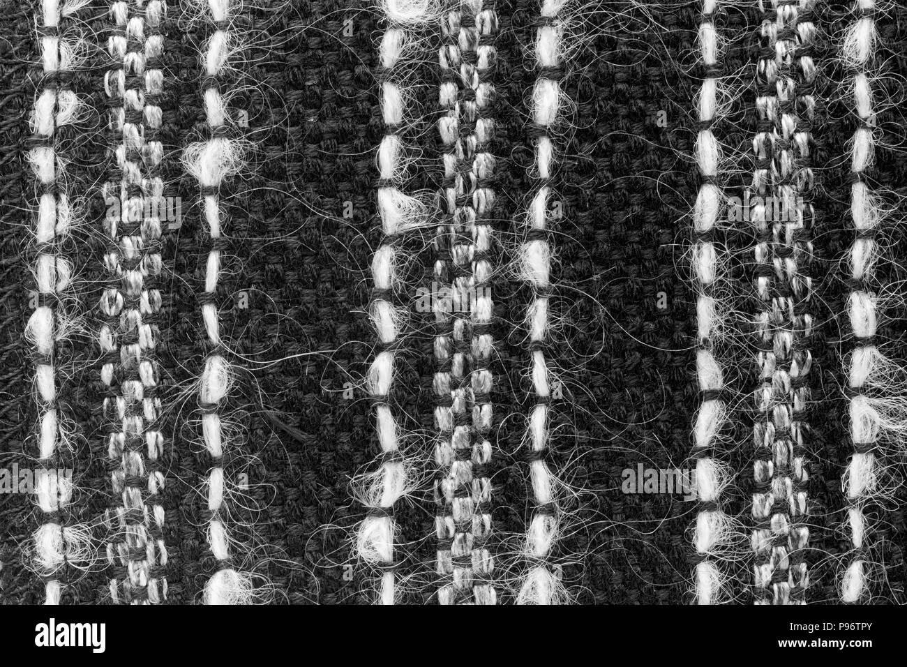 Black hand weaving matting tweed fabric texture with white stripes ...