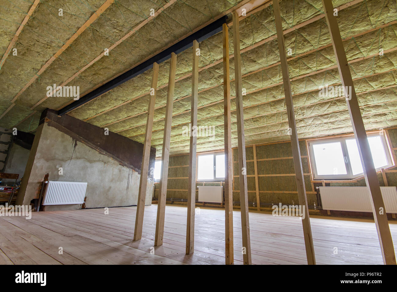 Construction and renovation of big light spacious empty room with oak ...