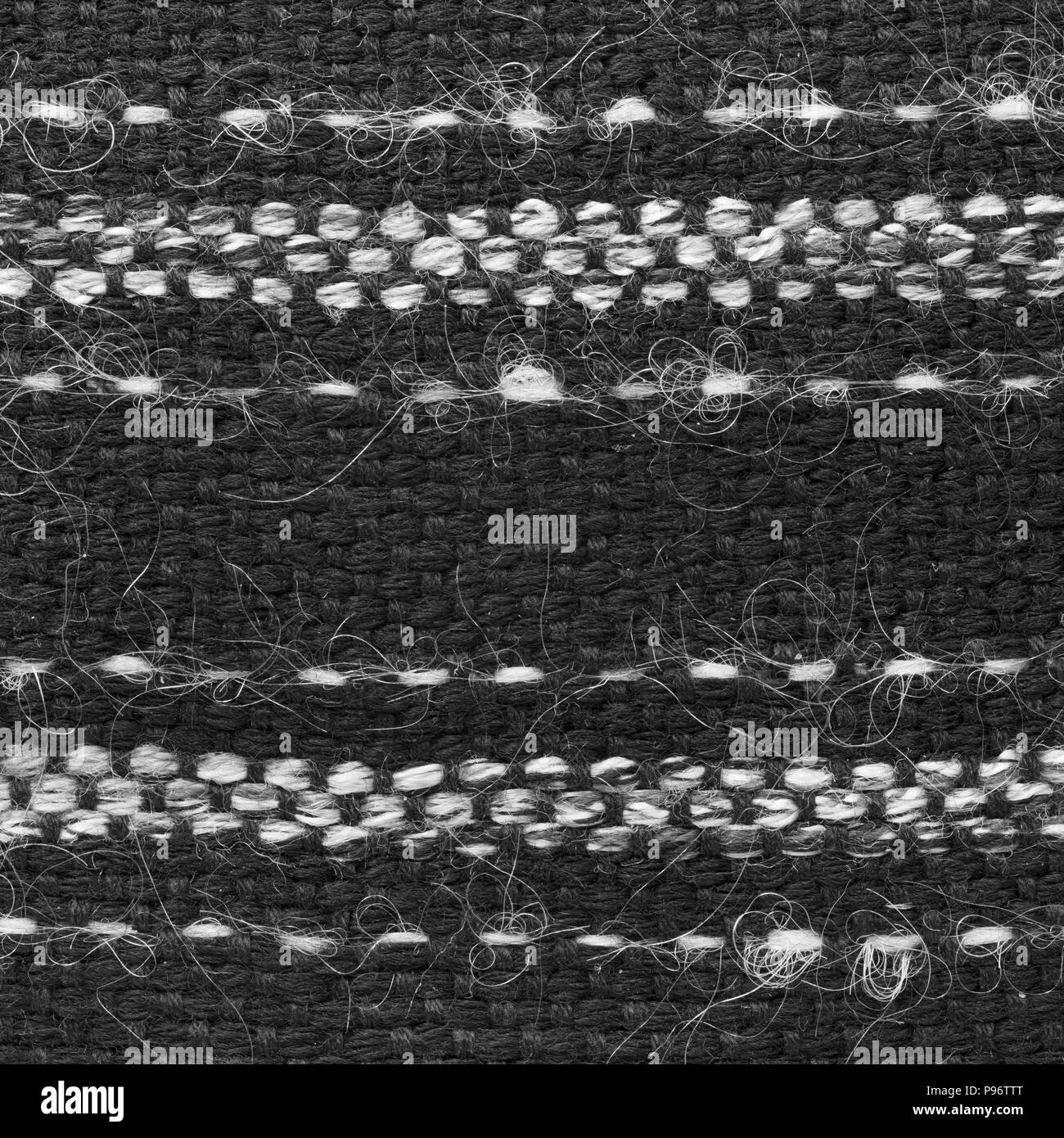 Black hand weaving matting tweed fabric texture with white stripes ...