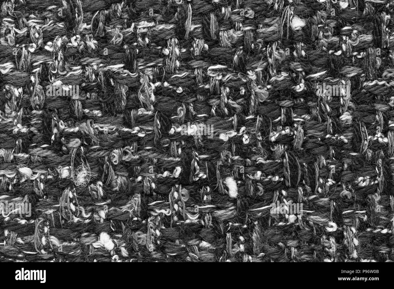 Black hand weaving matting tweed fabric texture. Closeup horizontal ...