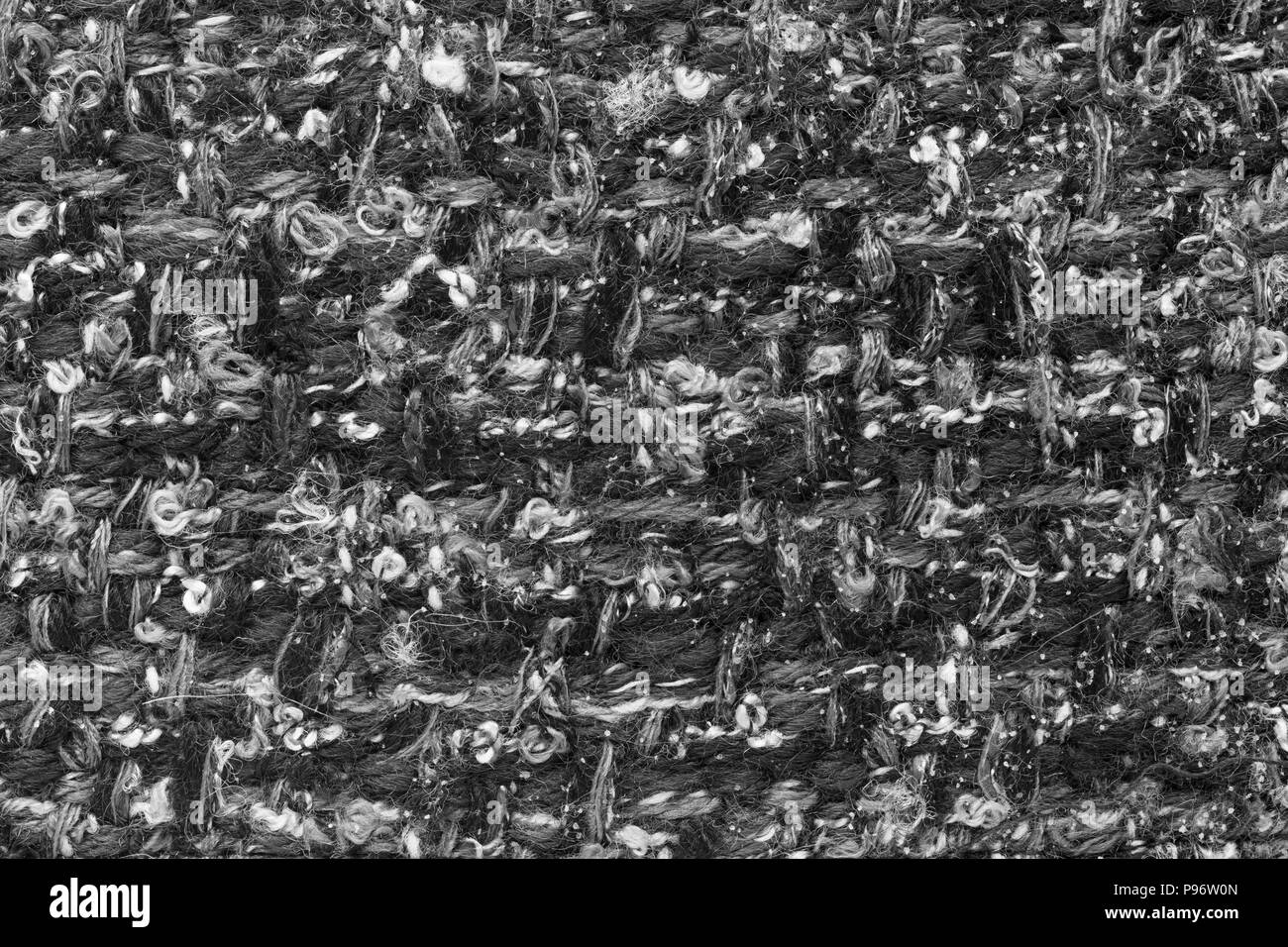 Black hand weaving matting tweed fabric texture. Closeup horizontal ...