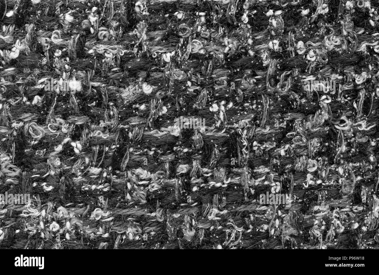 Black hand weaving matting tweed fabric texture. Closeup horizontal ...