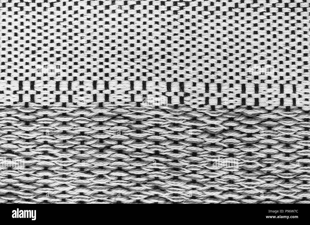 Black hand weaving matting tweed fabric texture. Closeup horizontal ...