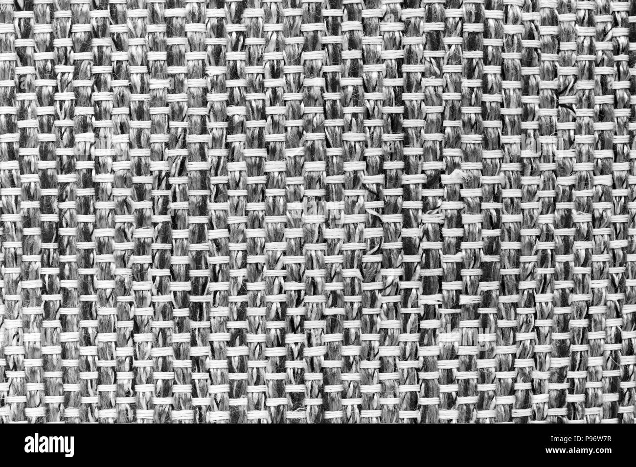 Black hand weaving matting tweed fabric texture. Closeup horizontal ...