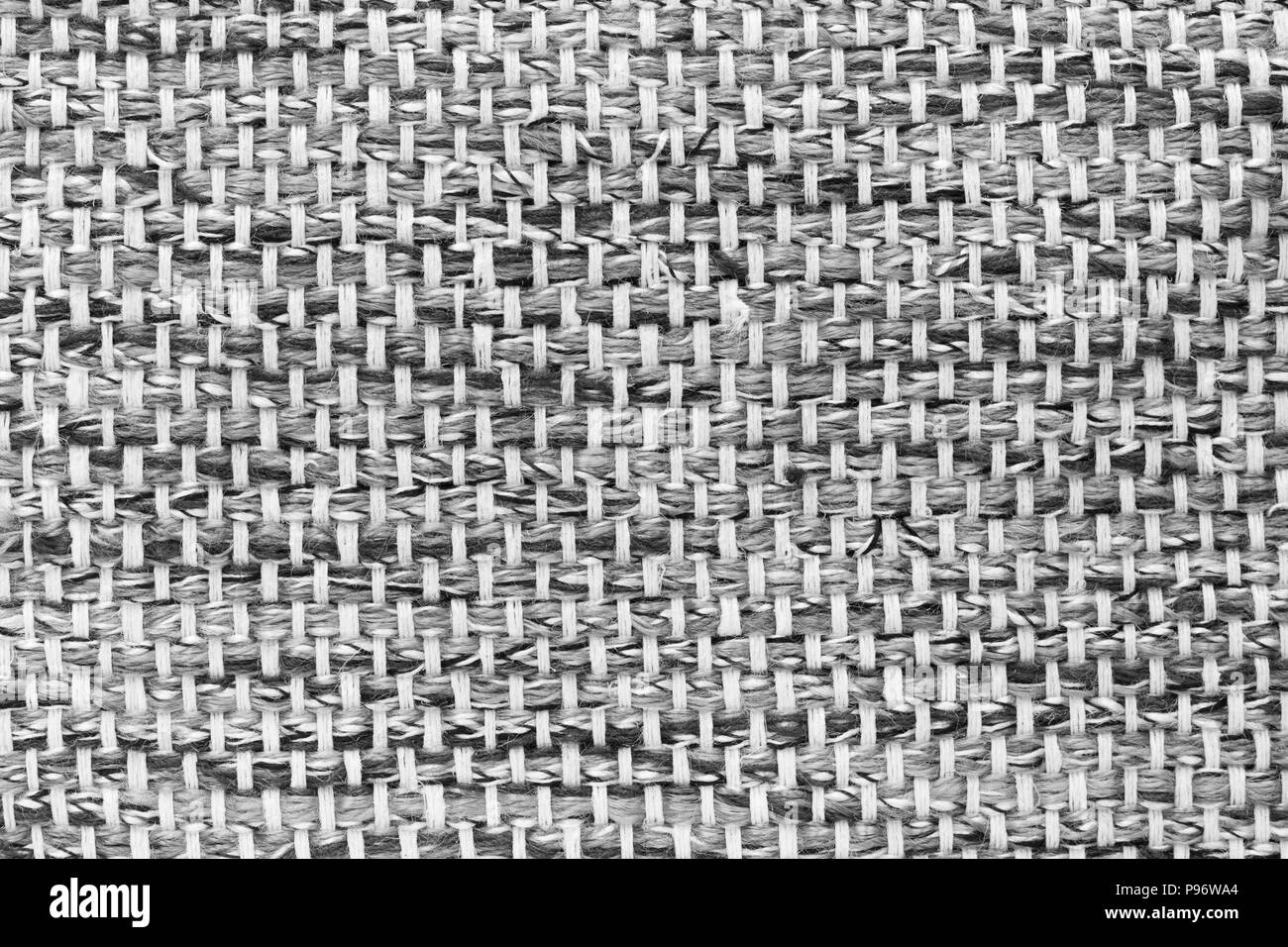 Black hand weaving matting tweed fabric texture. Closeup horizontal ...