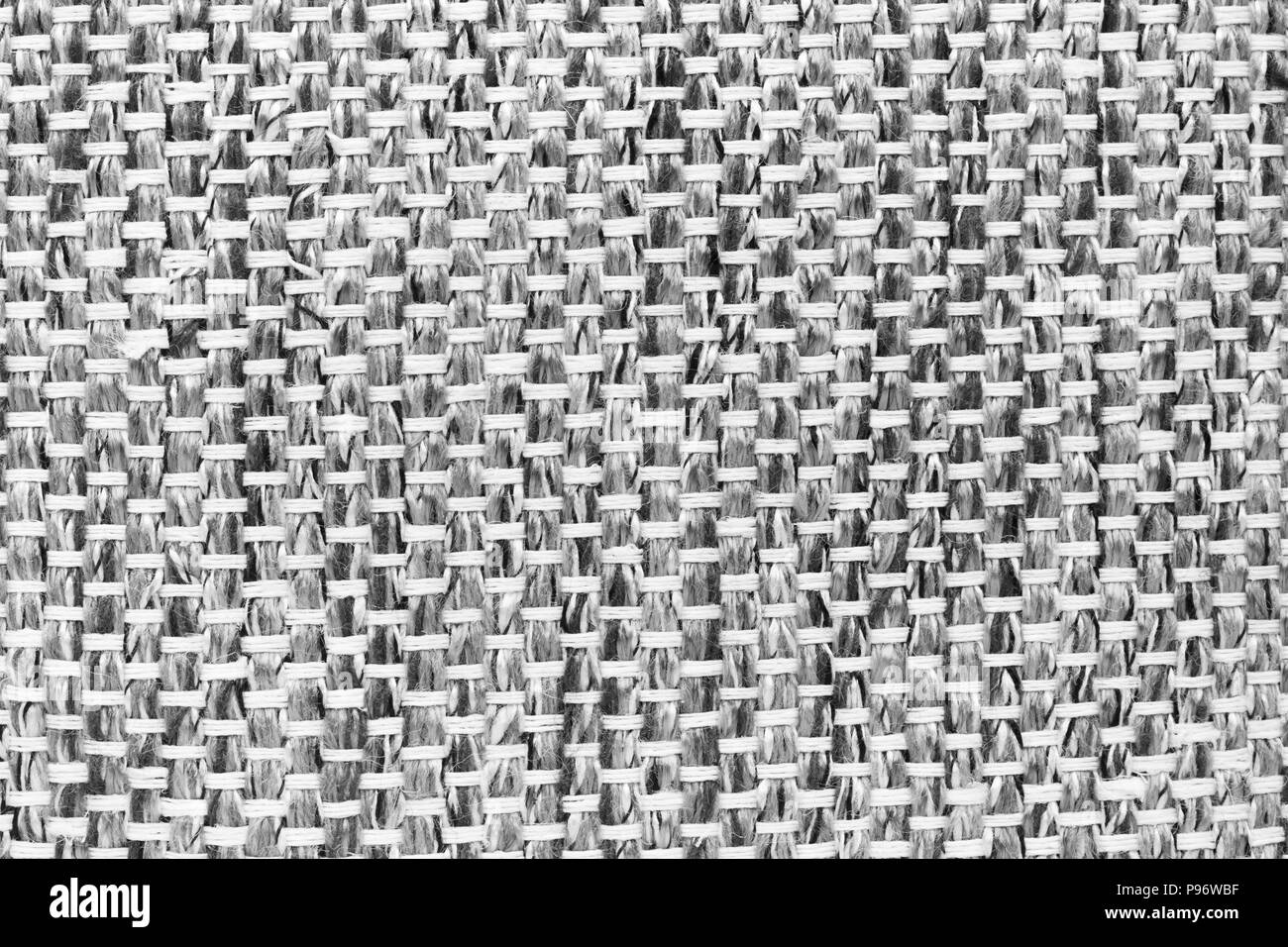 Black hand weaving matting tweed fabric texture. Closeup horizontal ...