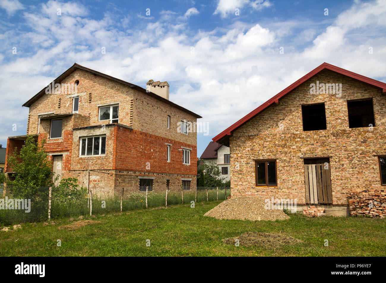 Land for development in rural neighborhood. Two new not finished brick ...