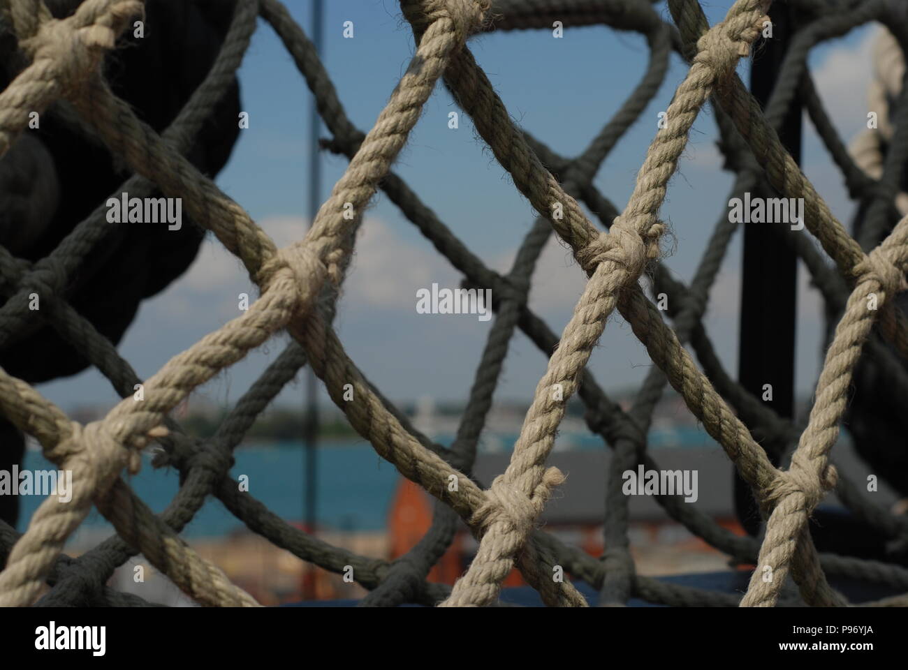 rope net of a ship in front of a dockyard Stock Photo - Alamy