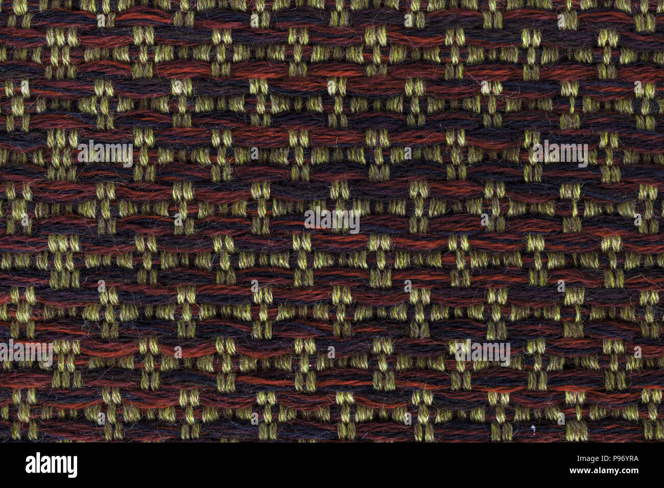 Colorful red-orange hand weaving matting tweed fabric texture. Closeup ...