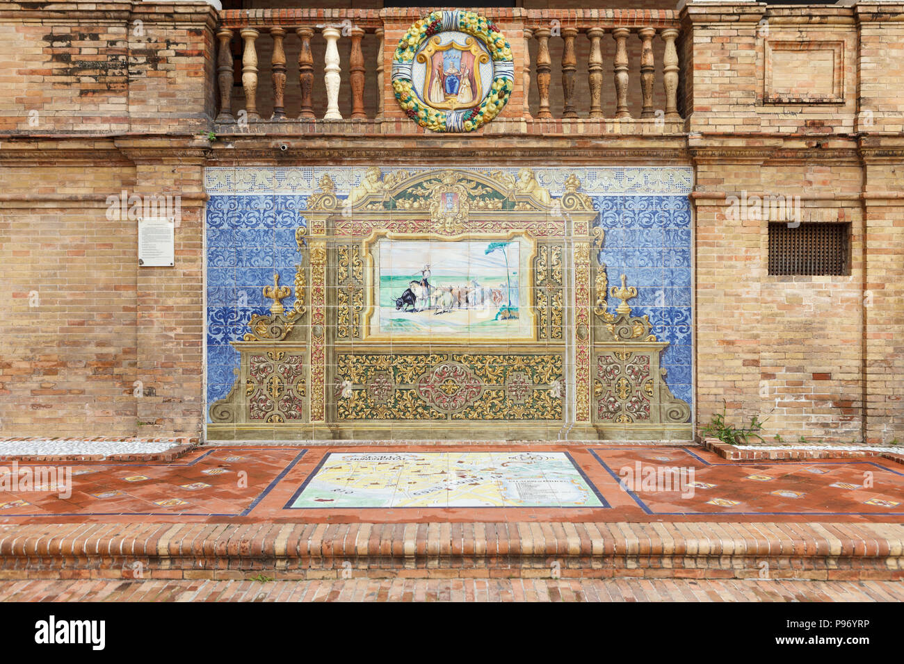 Symbol of Seville. Coat of arms, map and decorative panels on Plaza de ...