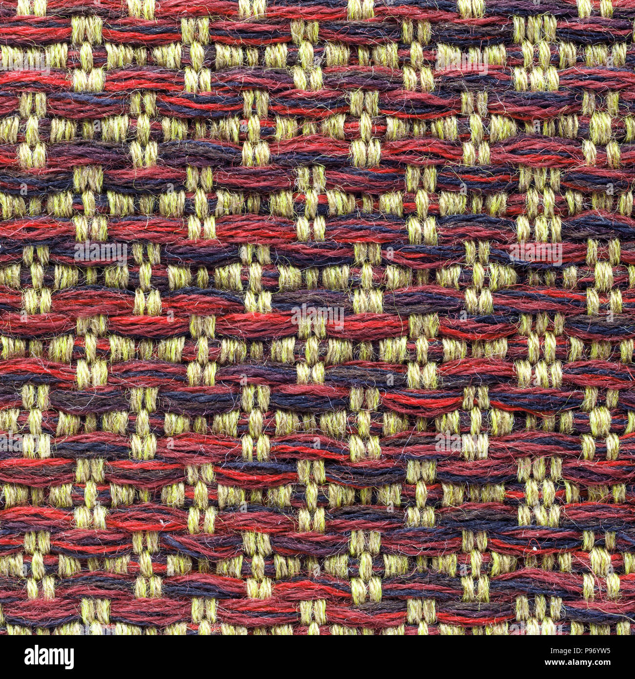 Colorful red-orange hand weaving matting tweed fabric texture. Closeup ...
