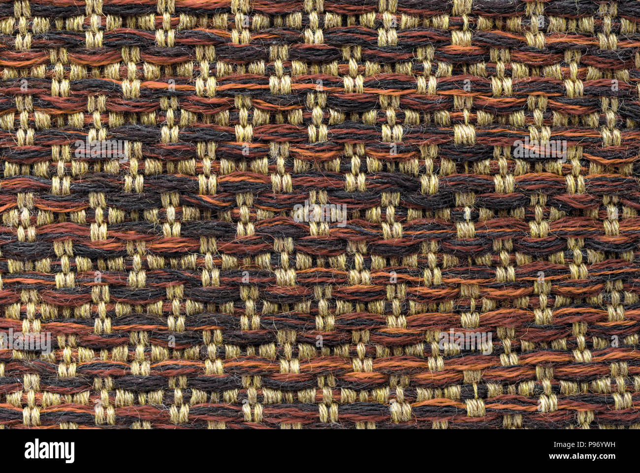 Colorful red-orange hand weaving matting tweed fabric texture. Closeup ...