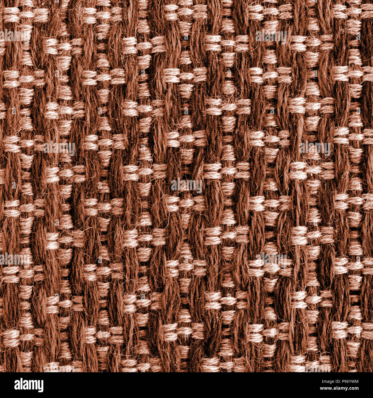 Colorful red-orange hand weaving matting tweed fabric texture. Closeup ...