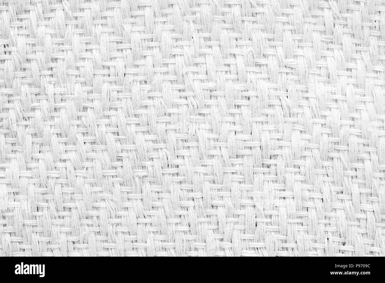 White hand weaving matting tweed fabric texture. Closeup horizontal ...