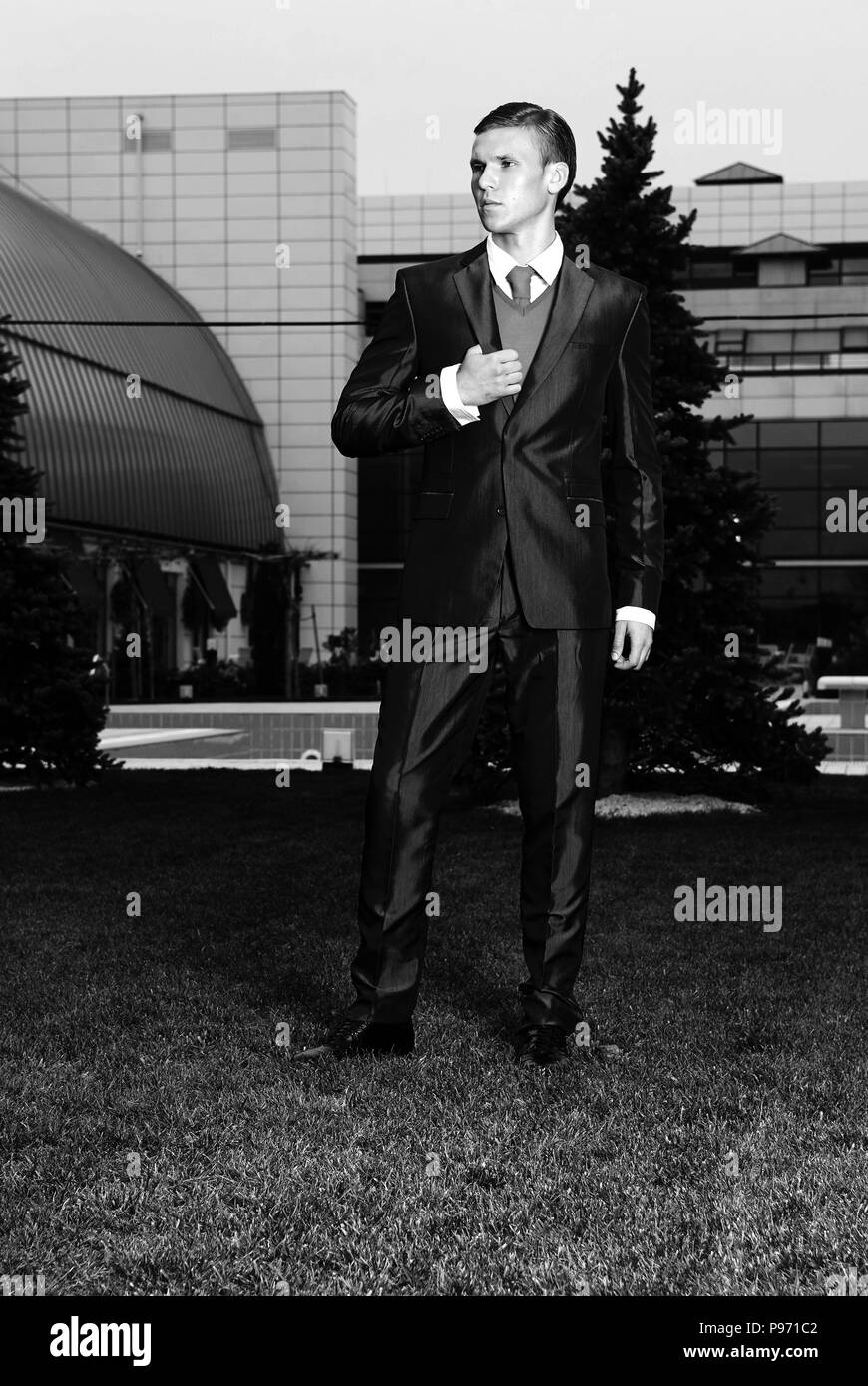 Successful young man standing in Black and White Stock Photos & Images ...
