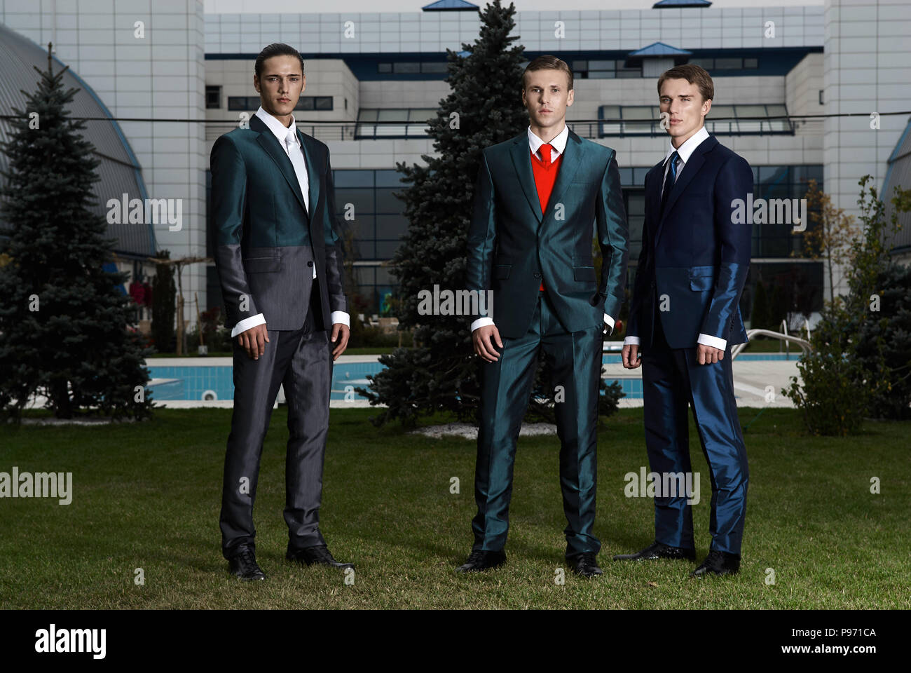 Three businessmen on megalopolis background Stock Photo - Alamy