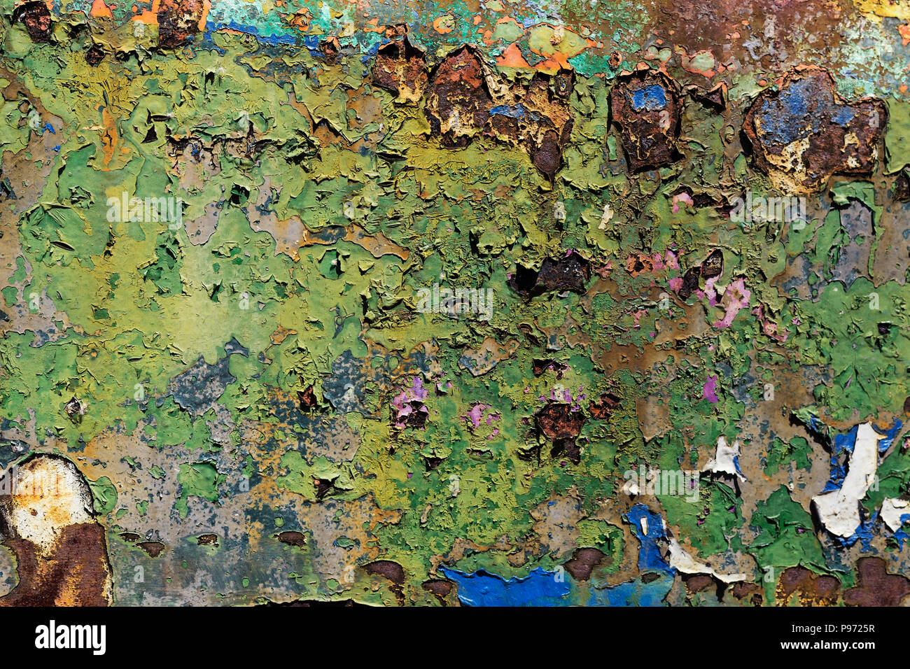 Texture of rusty colourful metal background with a peeling cracked ...