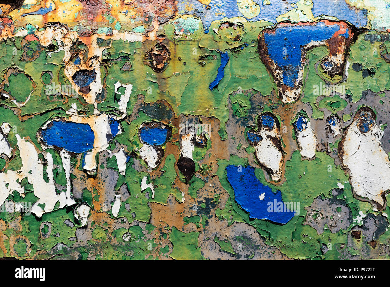 Texture of rusty colourful metal background with a peeling cracked ...