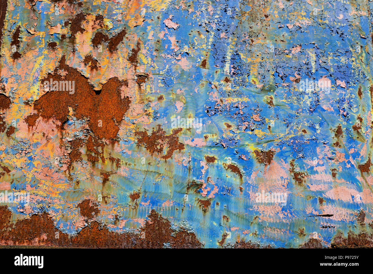 Texture of rusty colourful metal background with a peeling cracked ...