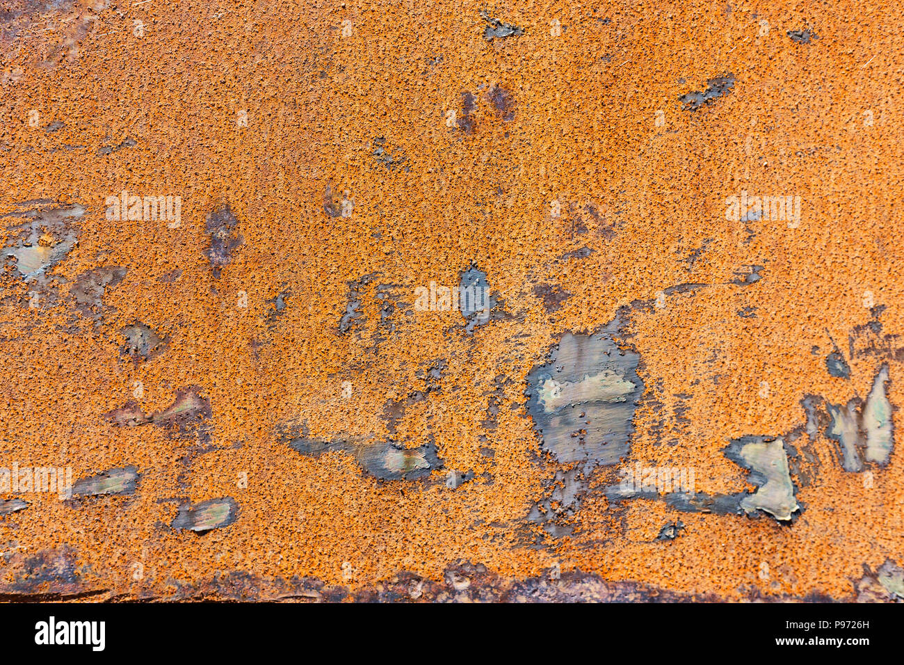 Texture of rusty colorful metal background with a peeling cracked ...