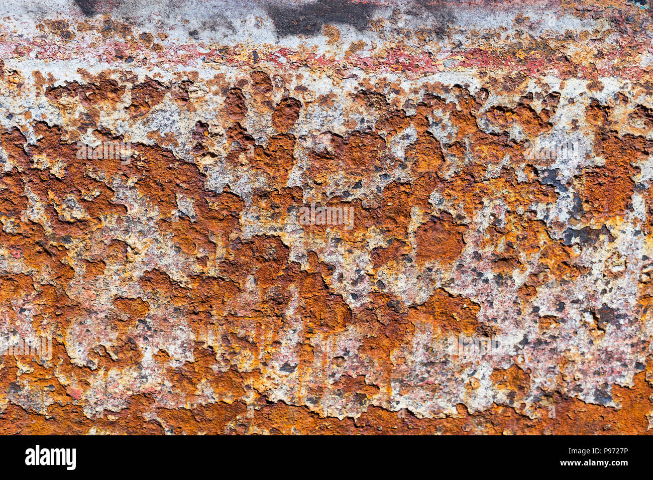 Texture of rusty colorful metal background with a peeling cracked ...