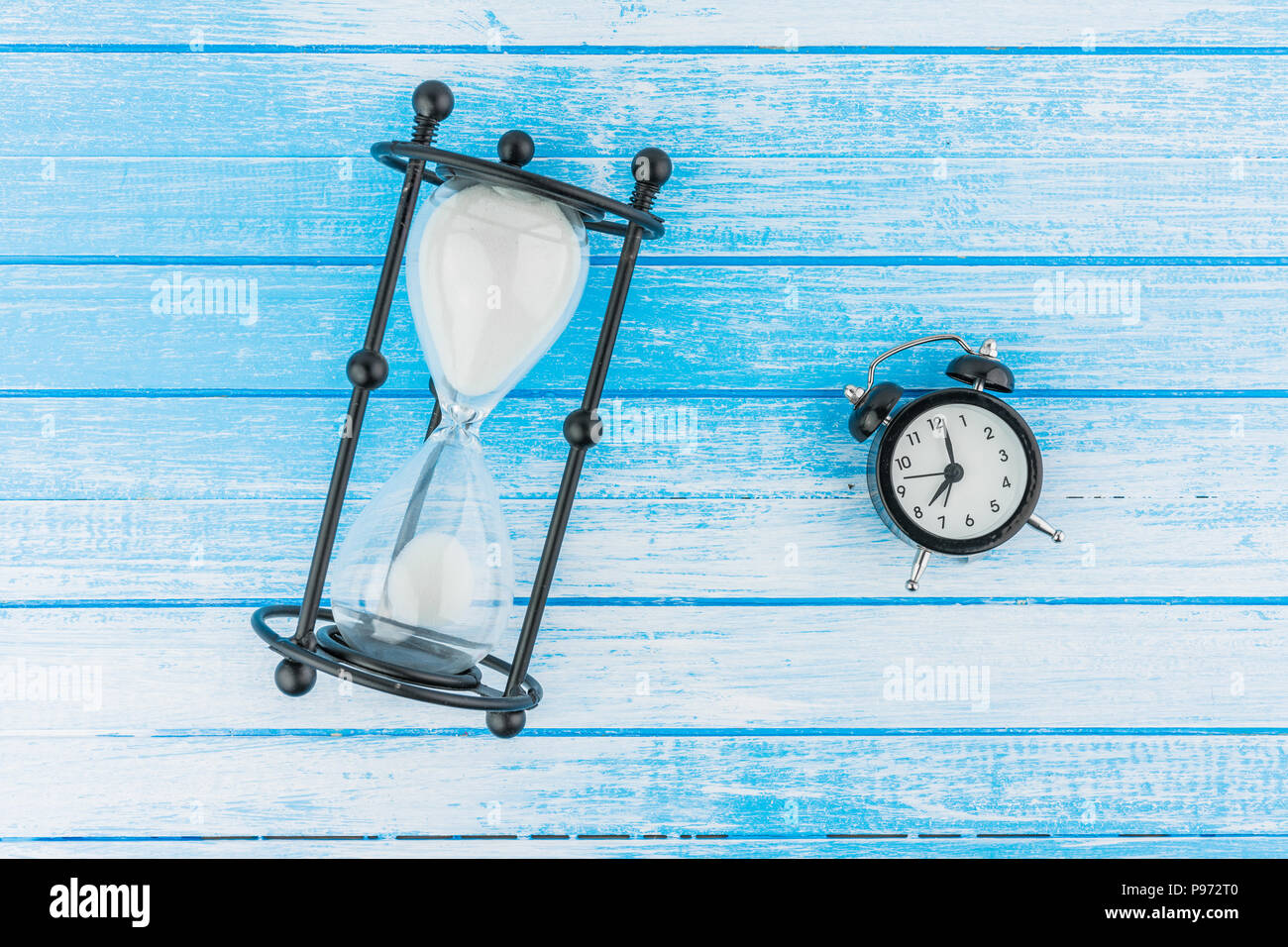 Hourglass blue background hi-res stock photography and images - Alamy