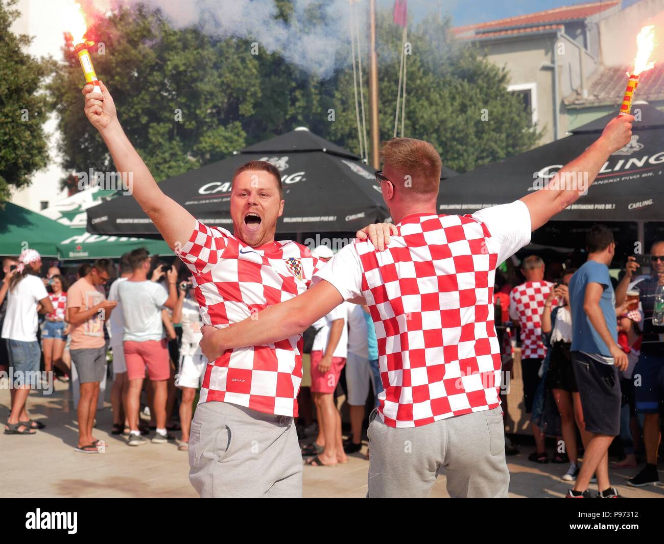 Two Croatian men are seen celebrating. Croatians in the Island of Pag ...