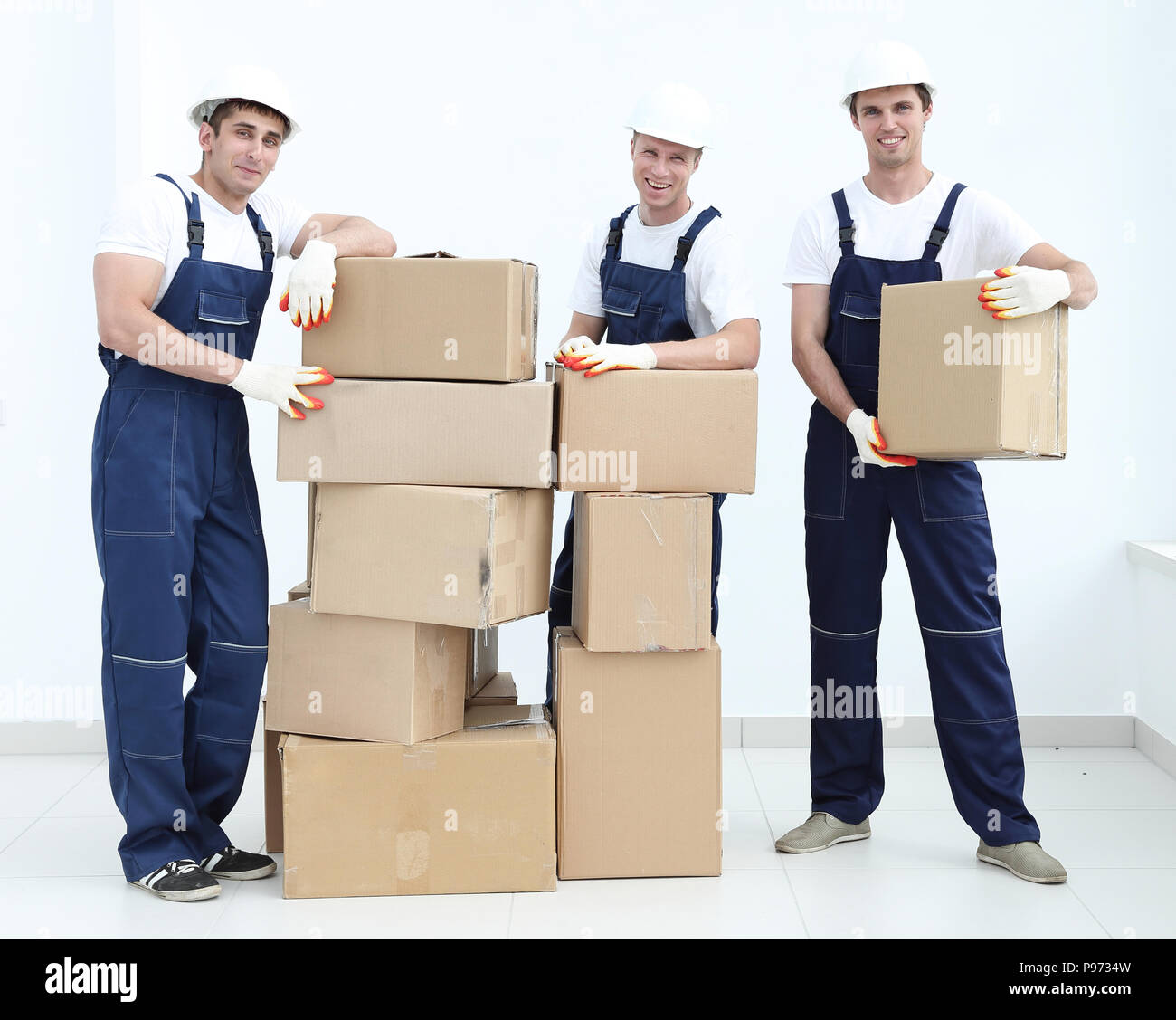 Group of people builders with boxes Stock Photo - Alamy