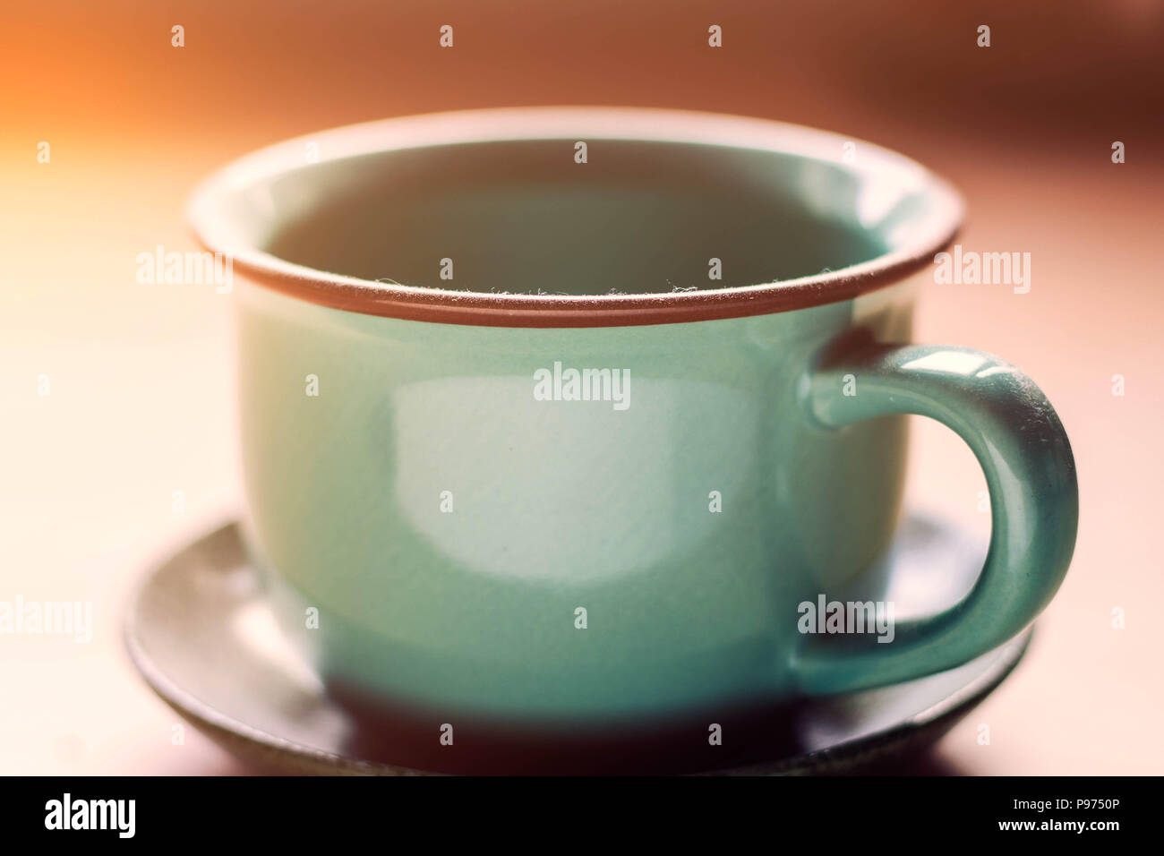 cup of dusty with close up on the desk Stock Photo - Alamy