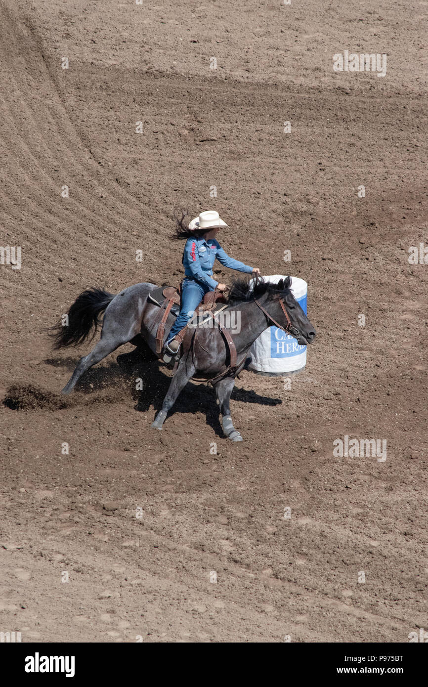 July 12, 2018. Cowgirl barrel racing at the Calgary Stampede Rodeo ...
