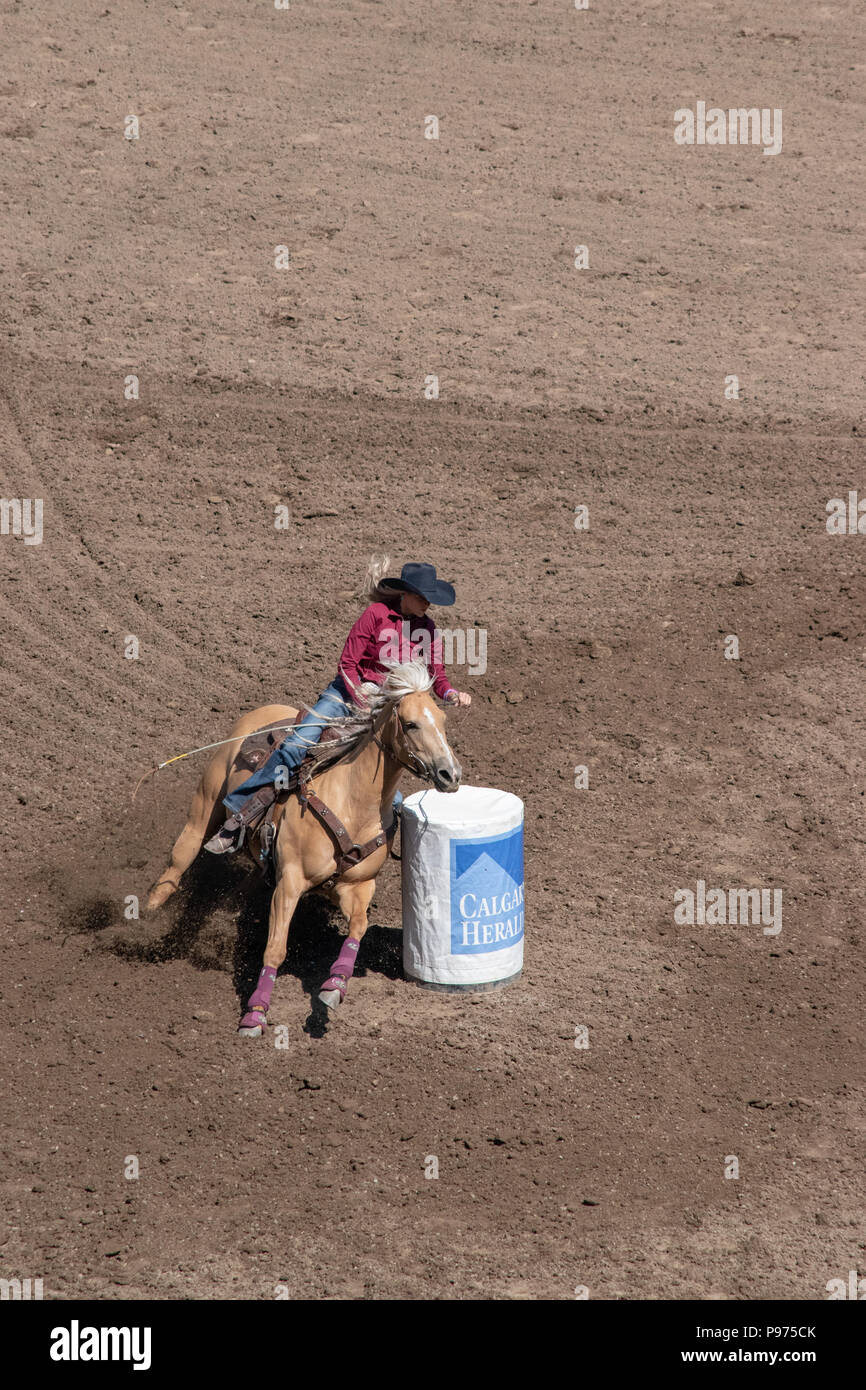 July 12, 2018. Cowgirl barrel racing at the Calgary Stampede Rodeo ...