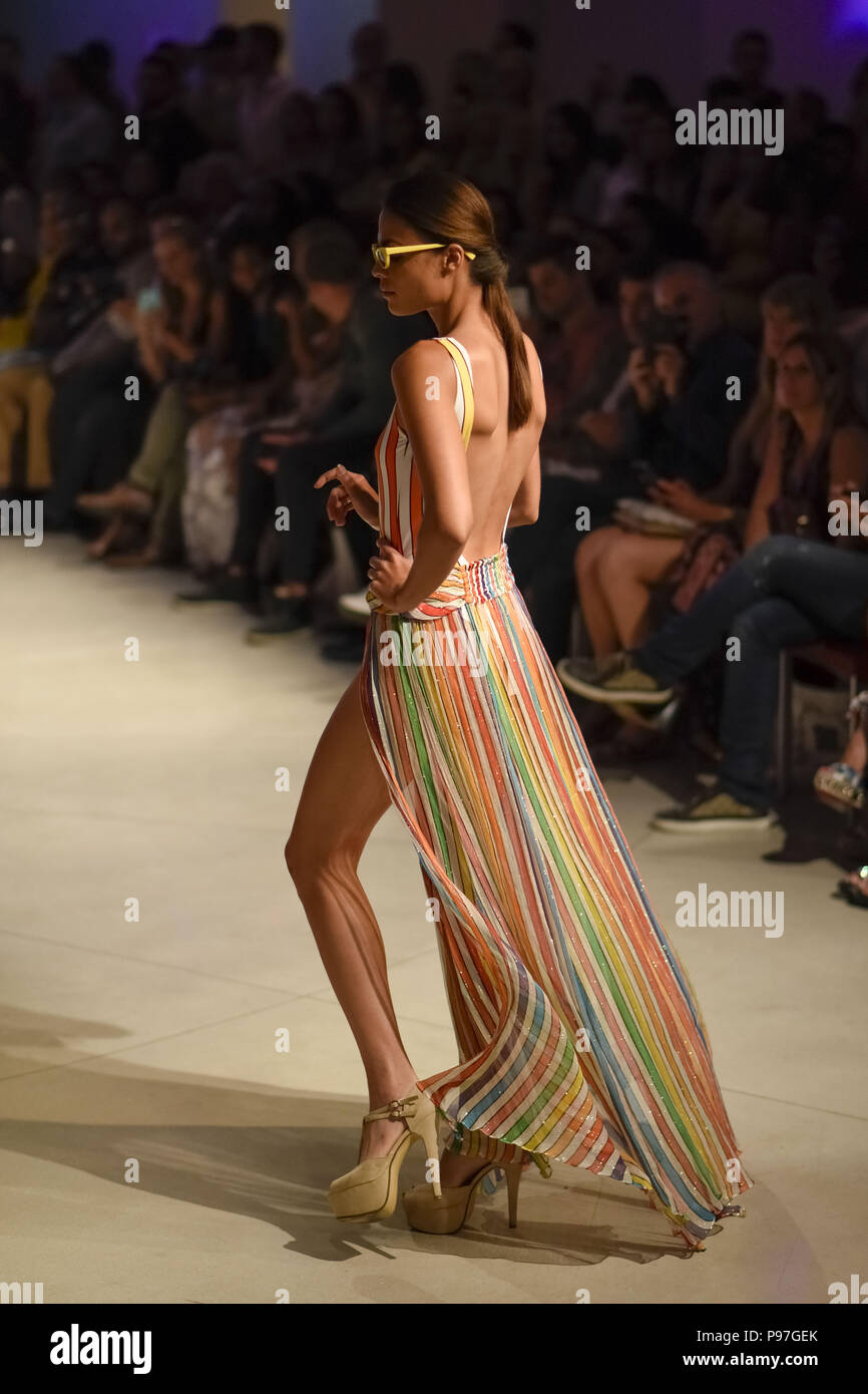 Miami Beach, Florida, USA. 14th July, 2018. A model walks on the runway ...
