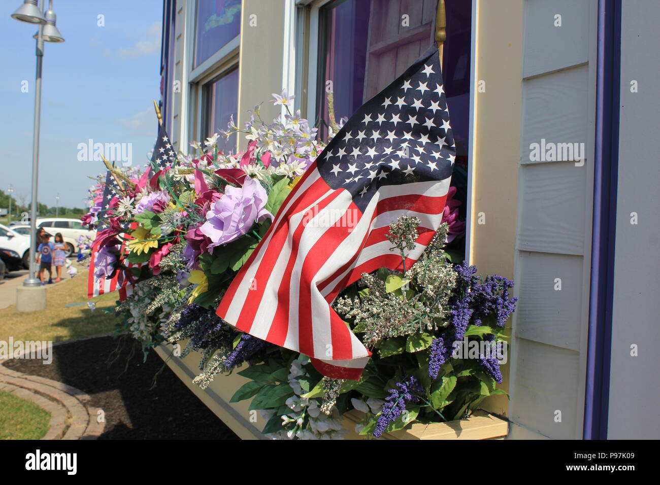 Fourth of July celebration flags planted on a windowsill of the ...