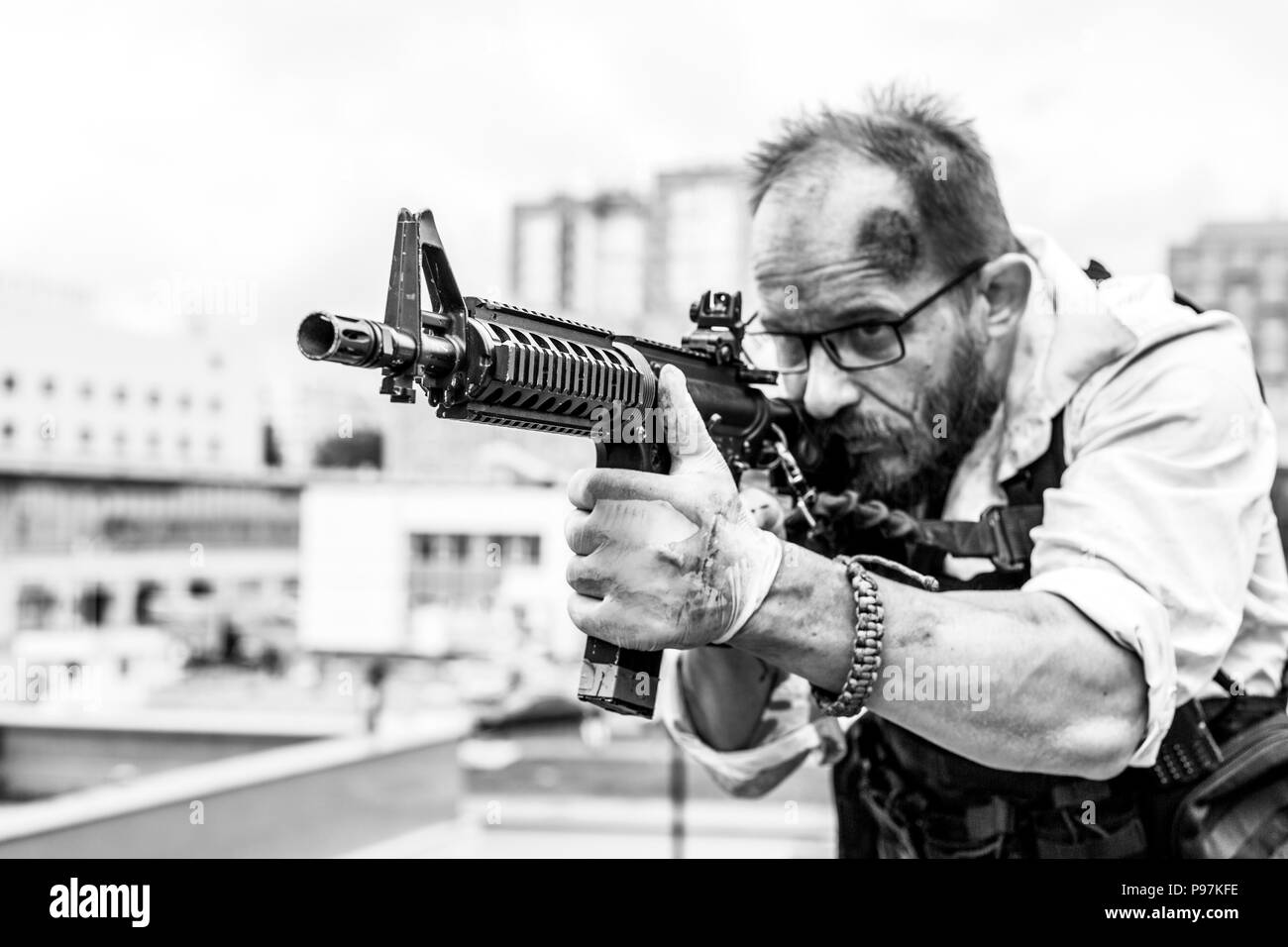 man took aim with the pistol. Action Movie Style Stock Photo - Alamy