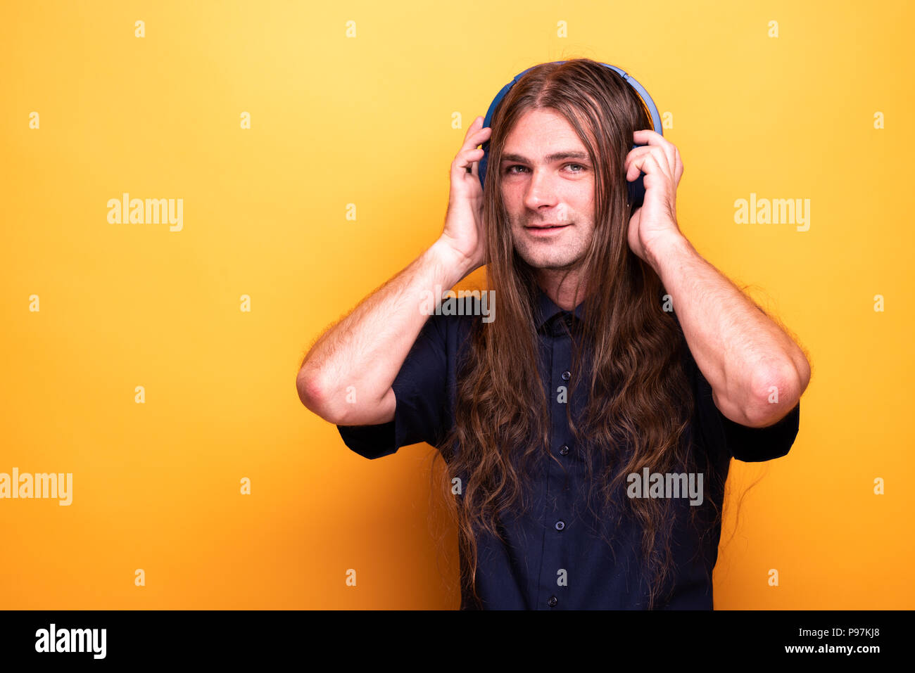 Crazy rock guy listening to music on headphones Stock Photo - Alamy
