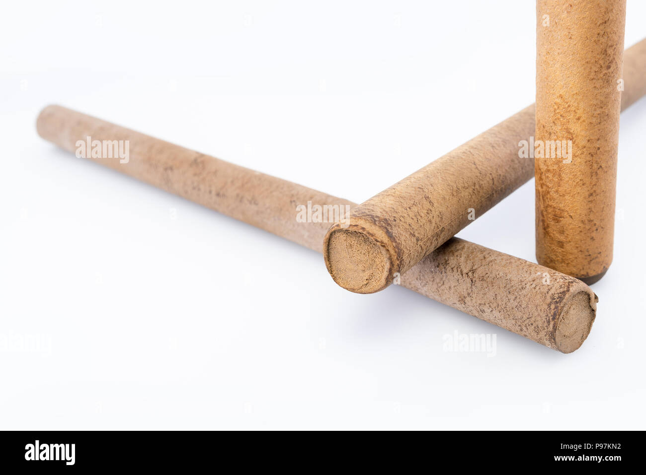 Ebonite sticks on white background, with shadows. Also is known as hard ...