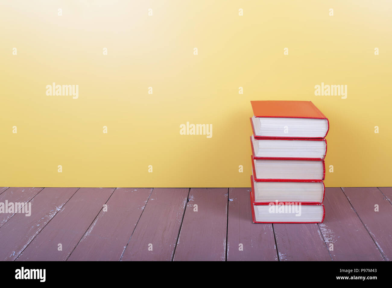 Science and education - Pile group of red books on the wooden table and ...